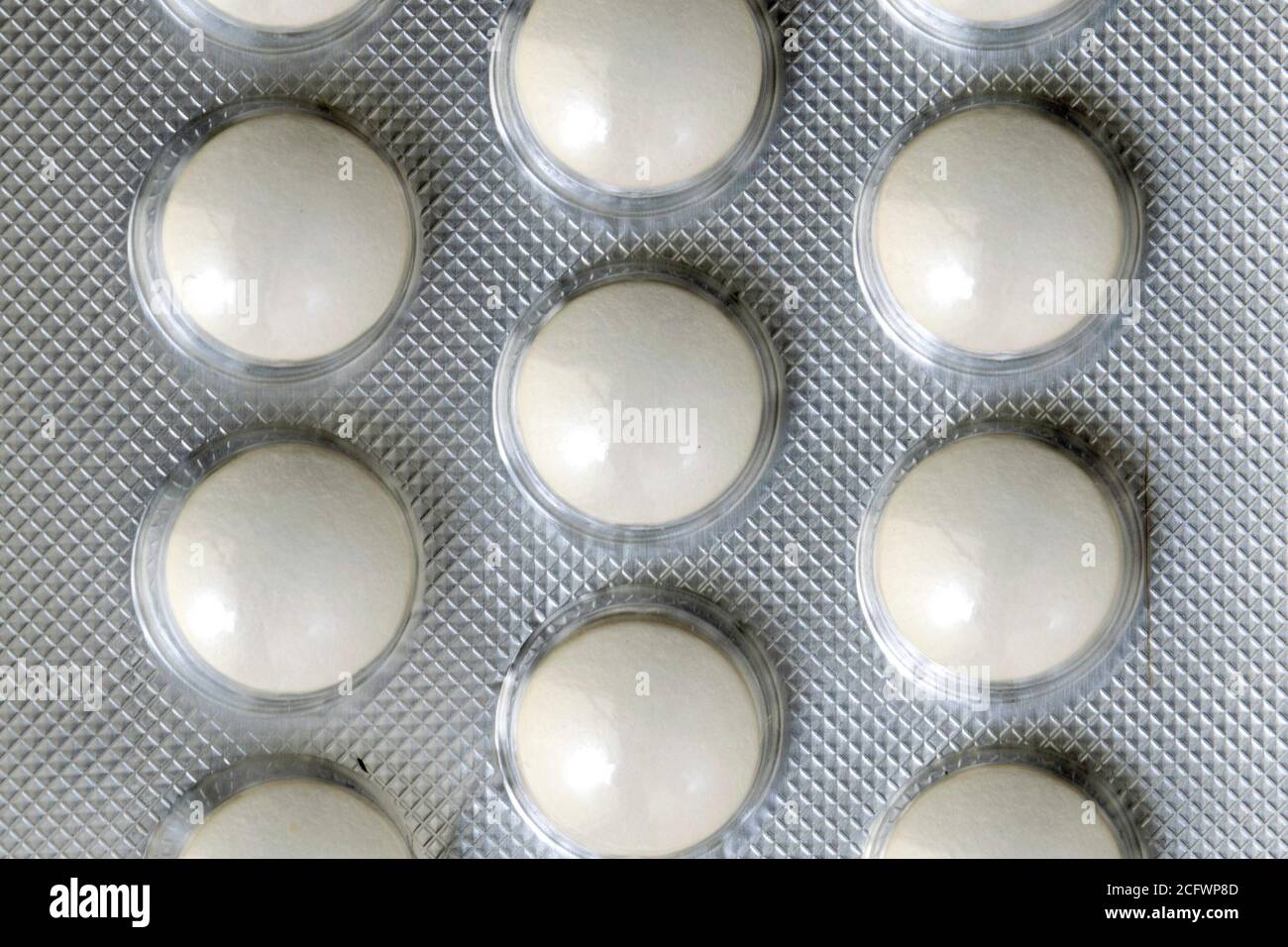 white pills in a transparent blister for background Stock Photo - Alamy