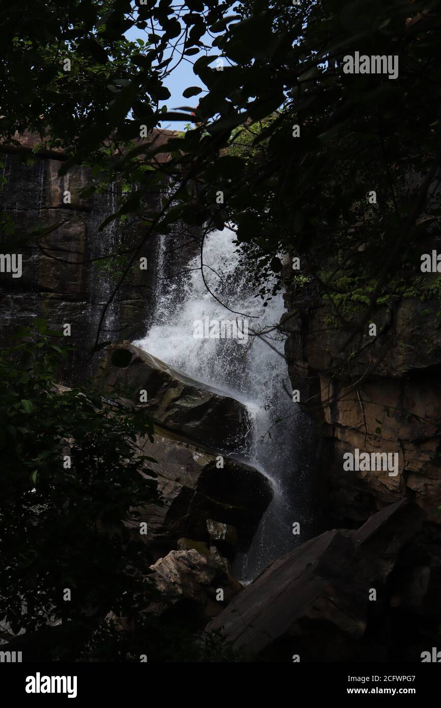 Cliff of a waterfall with selective focus. Landscape view of a flowing ...