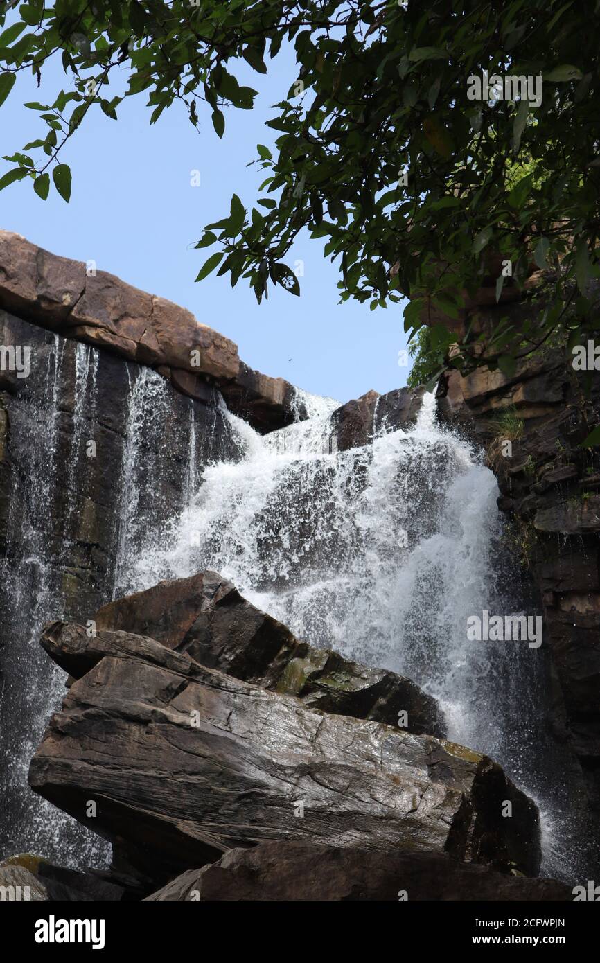 Cliff of a waterfall with selective focus. Landscape view of a flowing ...