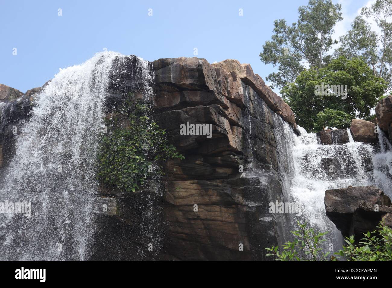 Cliff of a waterfall with selective focus. Landscape view of a flowing ...