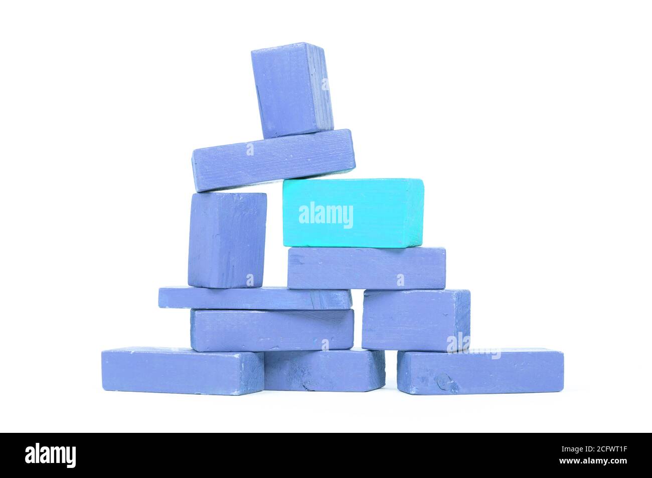 Vintage blue building blocks isolated on white background, one standing ...