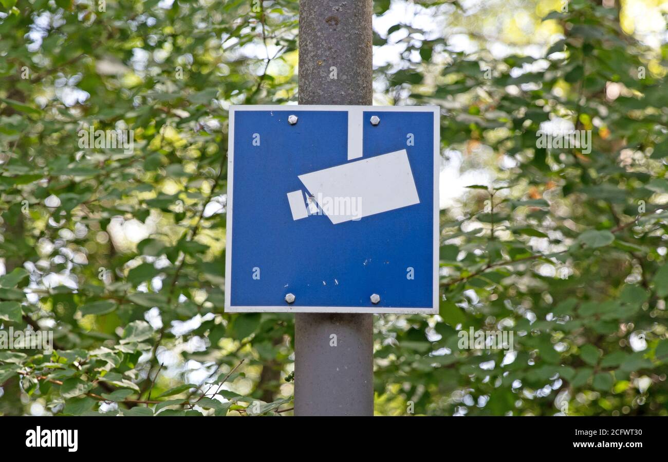 Surveillance camera sign, blue sign on a pole Stock Photo - Alamy