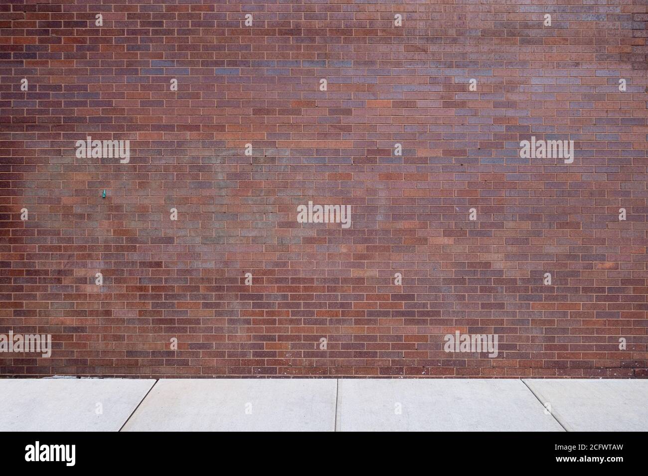 outdoor wlakway sidewalk with red brick wall Stock Photo - Alamy