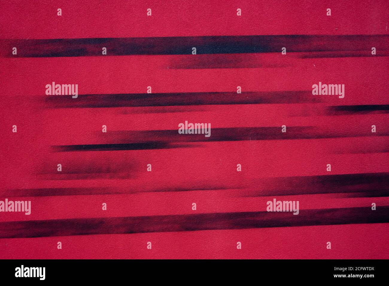 black line painted marks on red wall background Stock Photo - Alamy