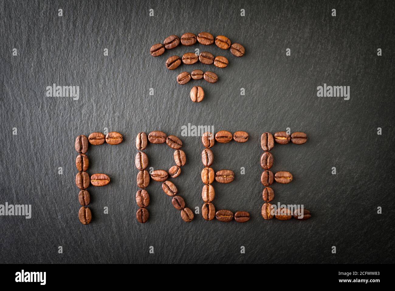 Sign of free WI-FI internet made with coffee beans on a dark background ...