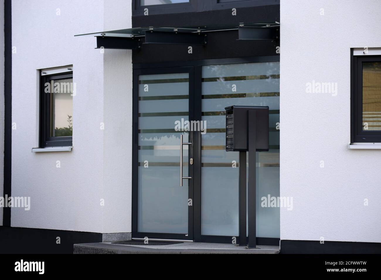 Modern front door Stock Photo - Alamy