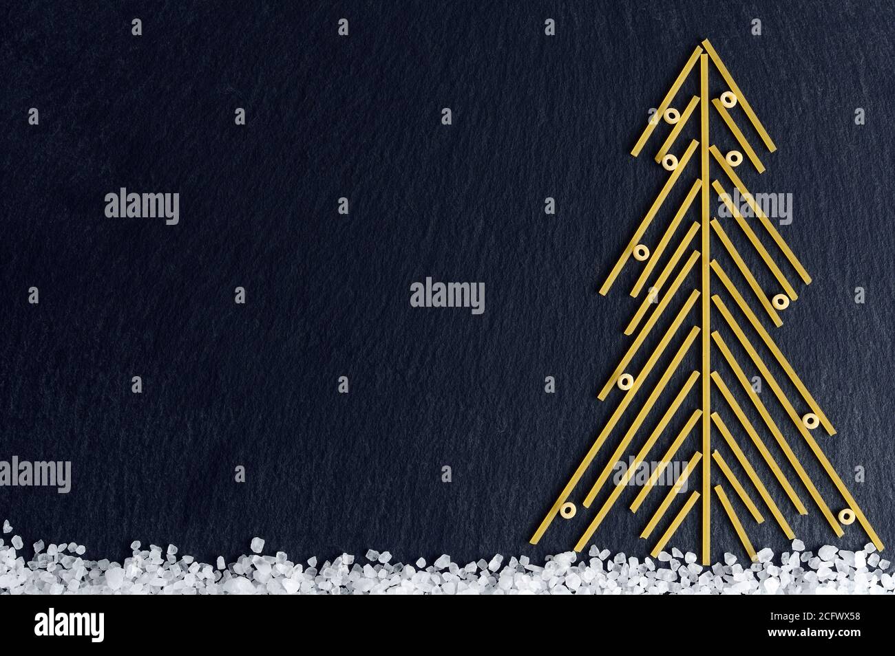 Christmas tree made with italian spaghetti with salt on a slate ...