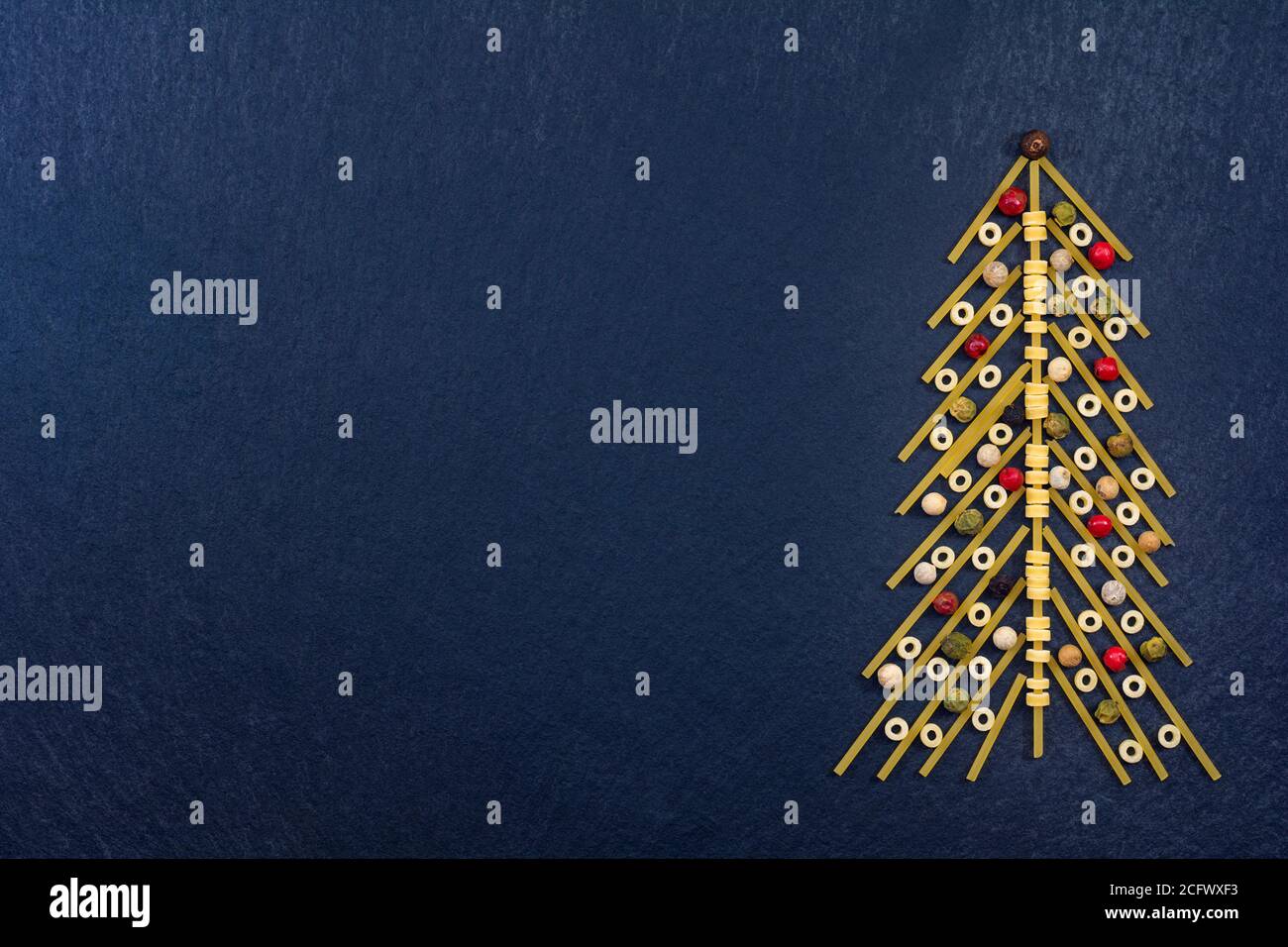 Christmas tree made with italian spaghetti with colorful pepper, on a ...