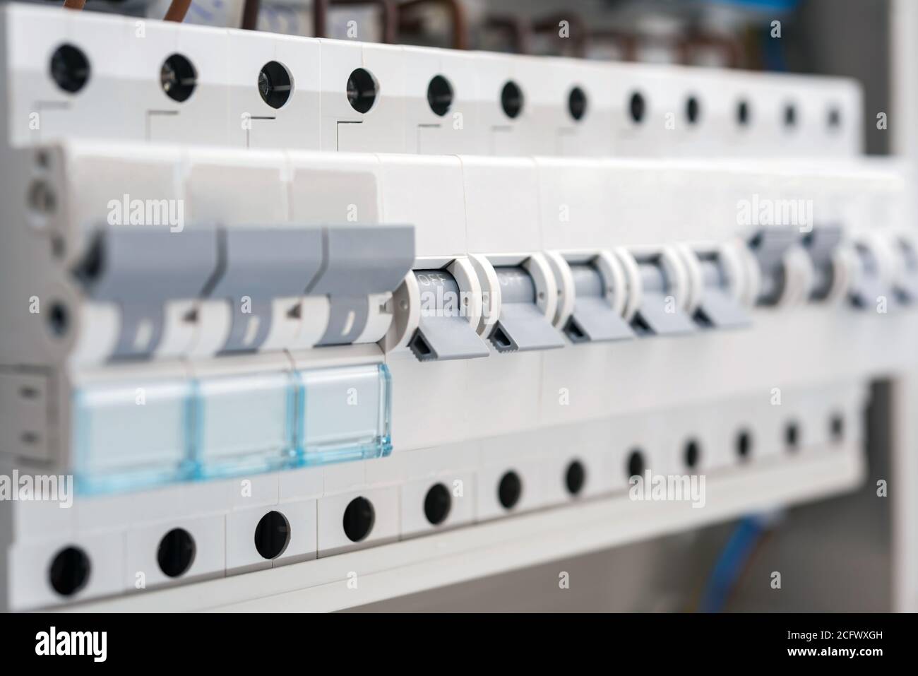 Closeup view automatic fuses. Voltage switchboard electrical background ...