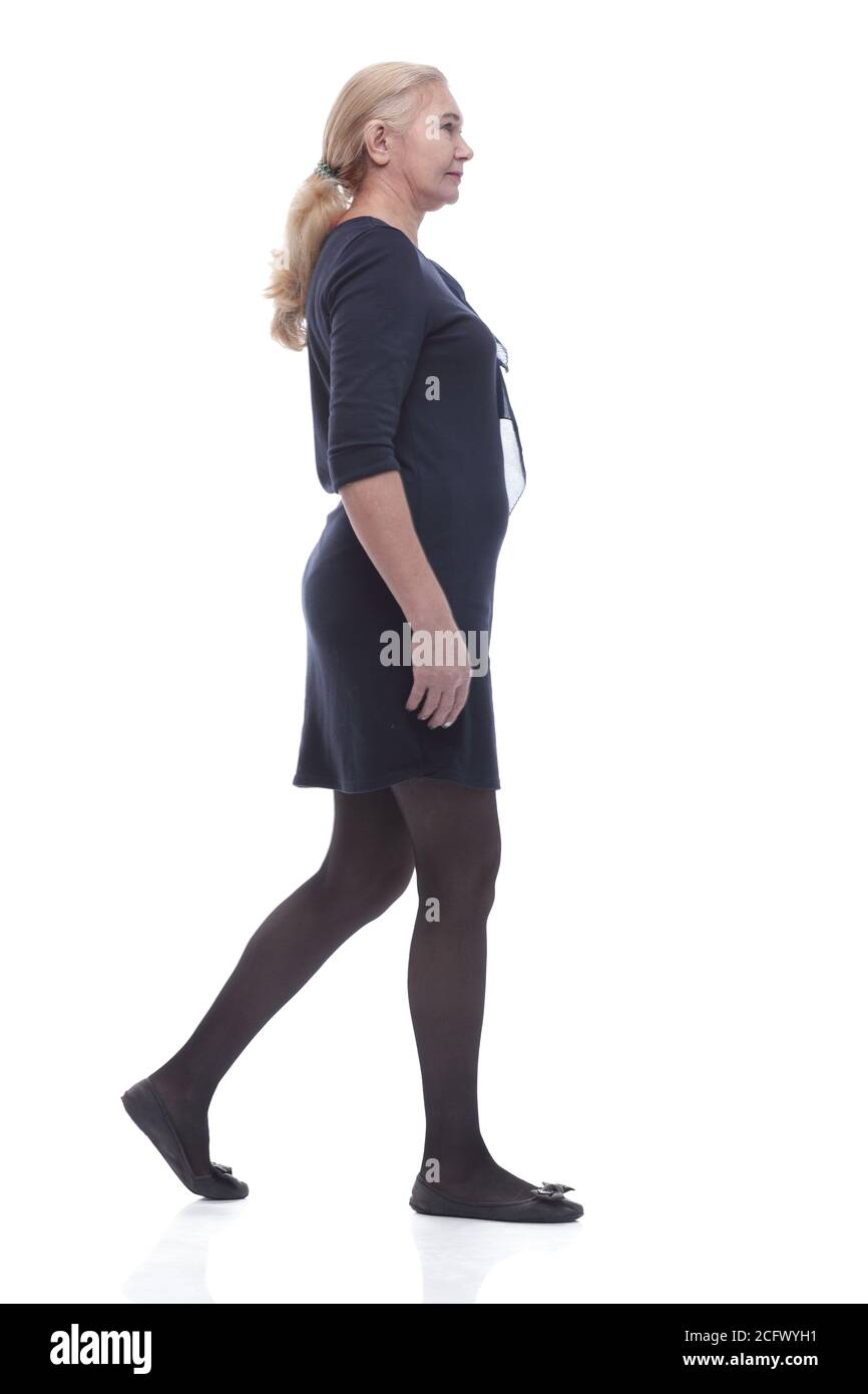 side view. confident mature woman stepping forward Stock Photo - Alamy