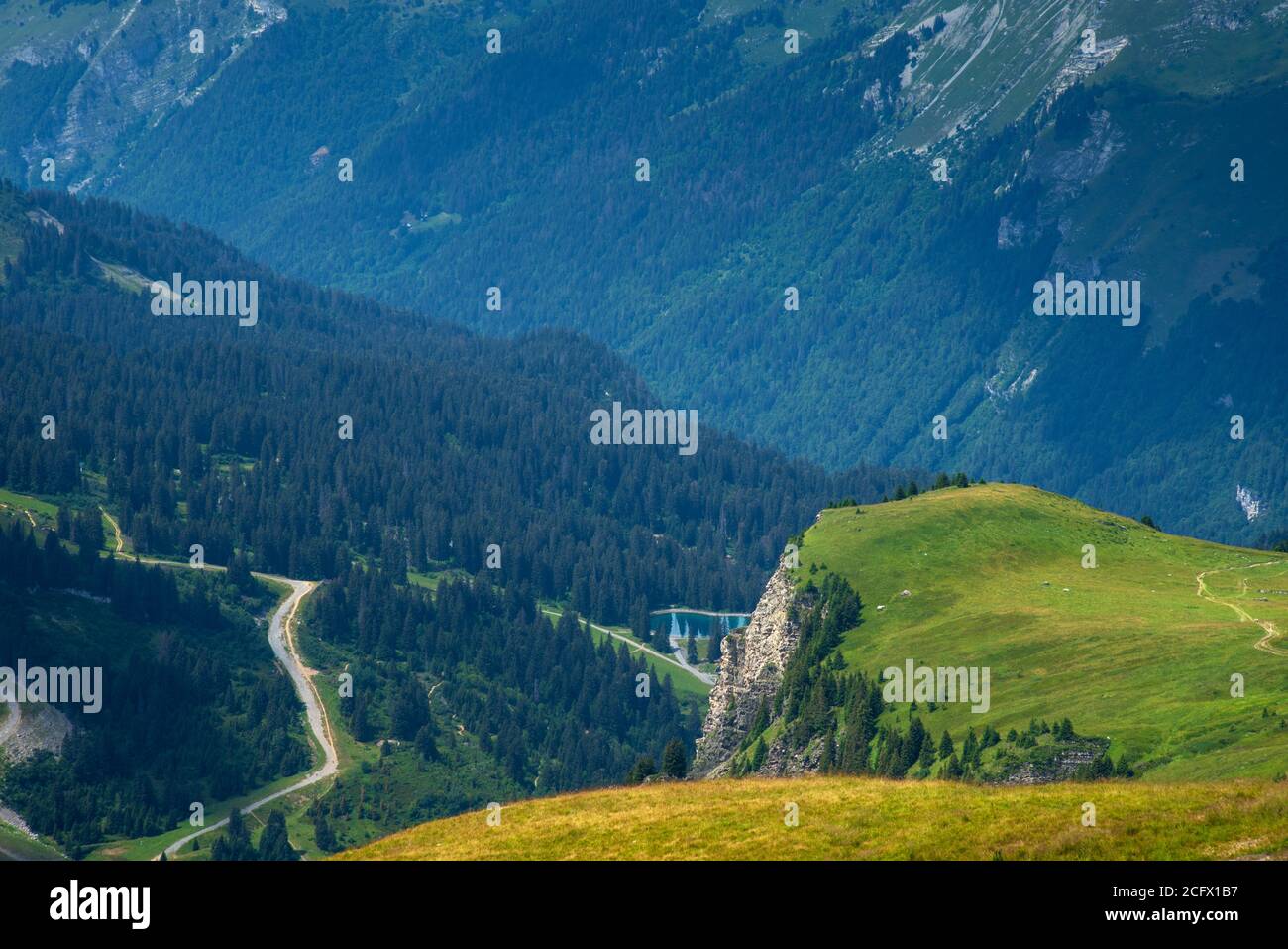 Beautiful Alpine mountain landscape with small green lake in French ...