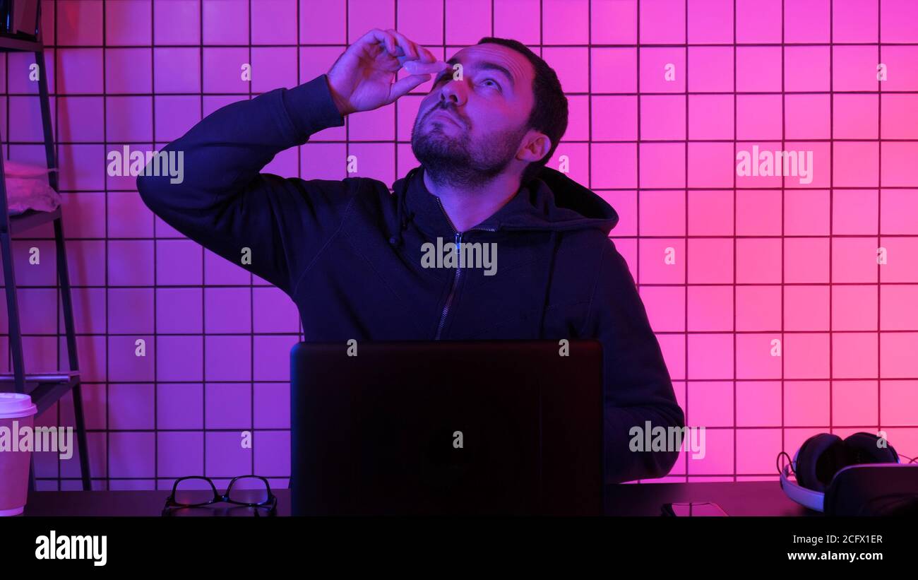 Young gamer taking off glasses feels eye strain tension tired of ...