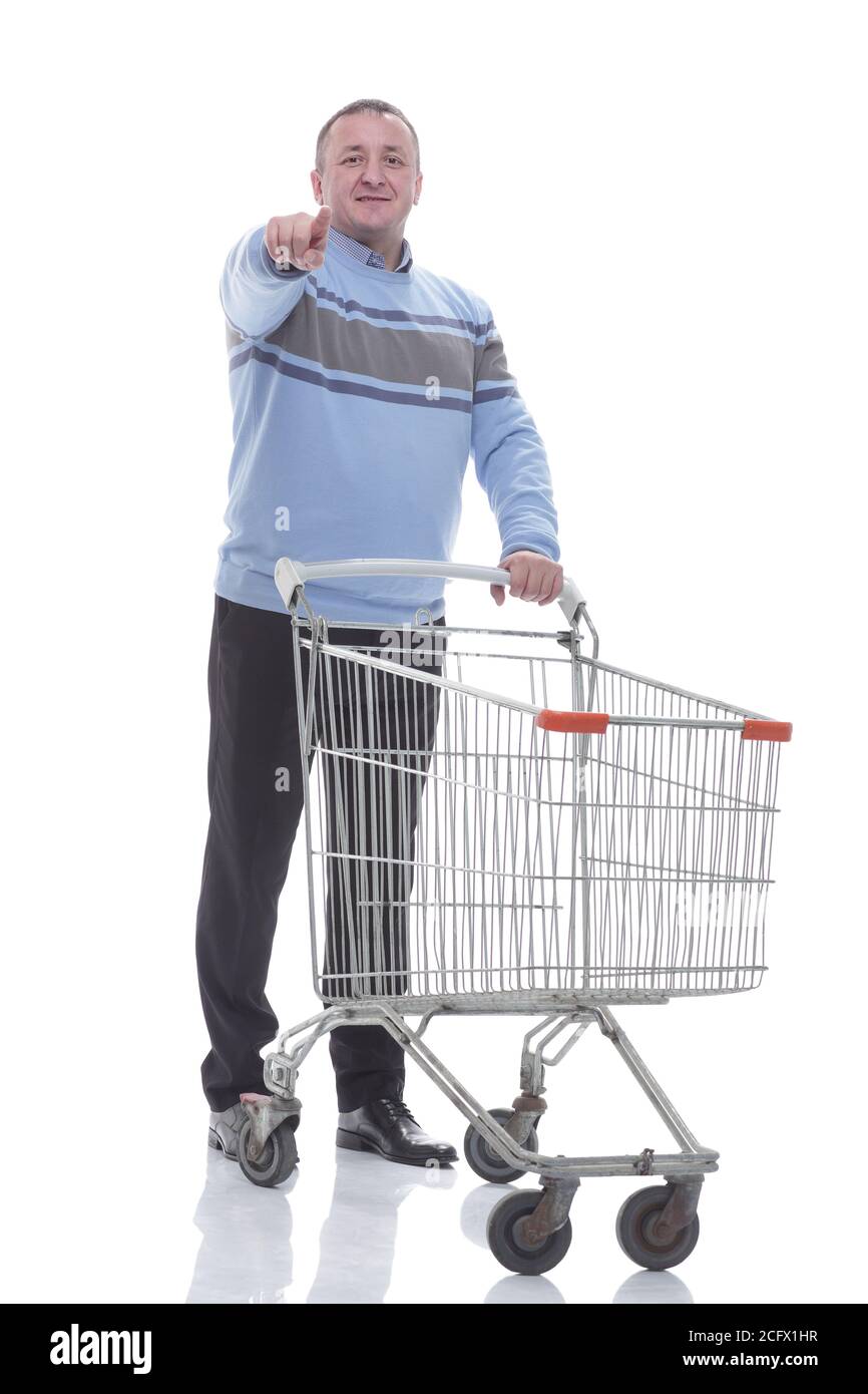 in full growth. confident casual man with shopping cart Stock Photo - Alamy