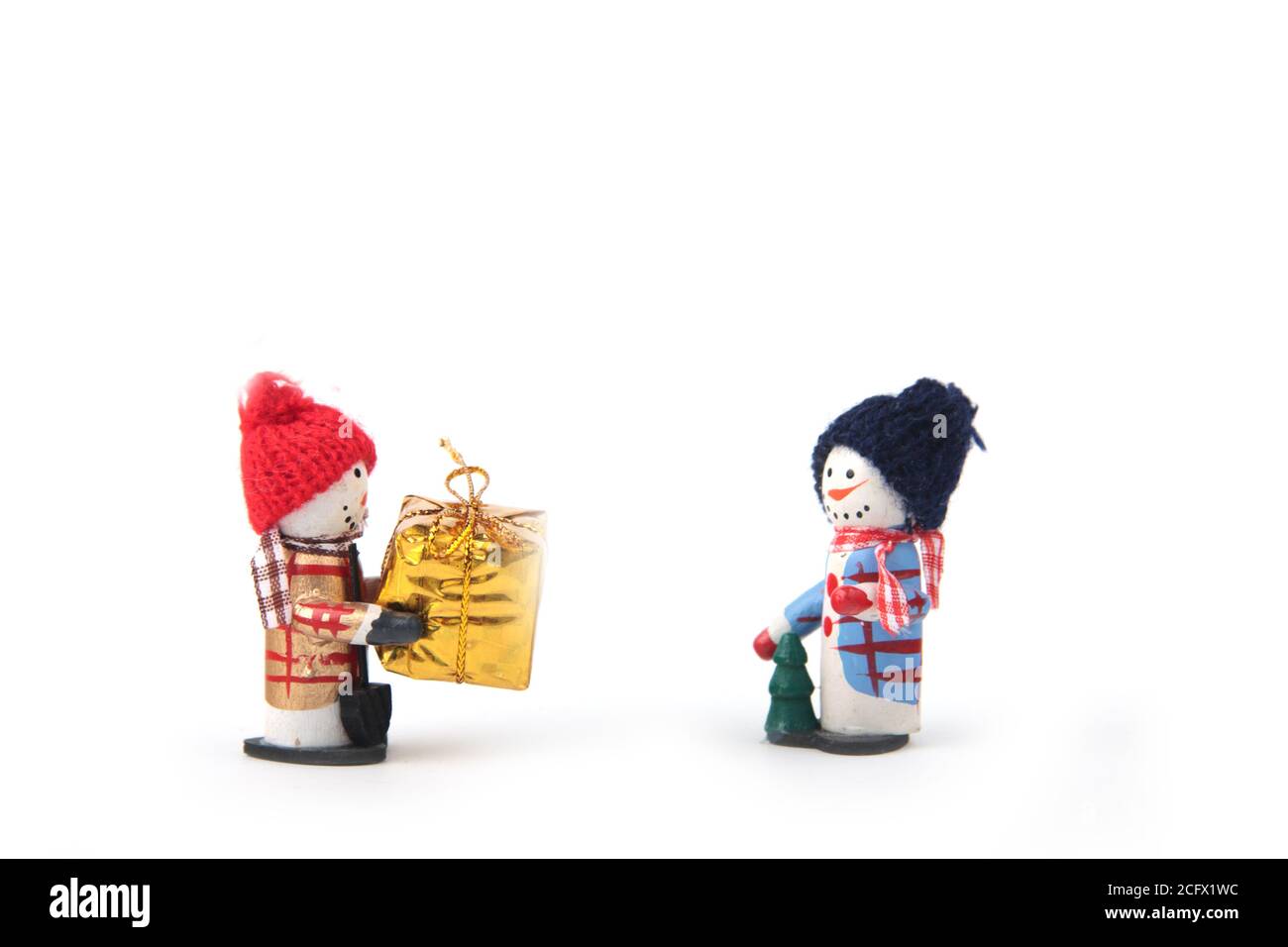 Gives a wrapped box to another person. Present giving or messenger ...