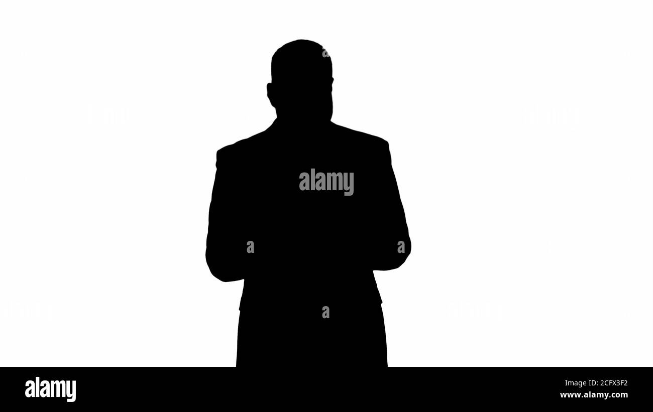 Silhouette Businessman on the phone typing text message walking Stock ...