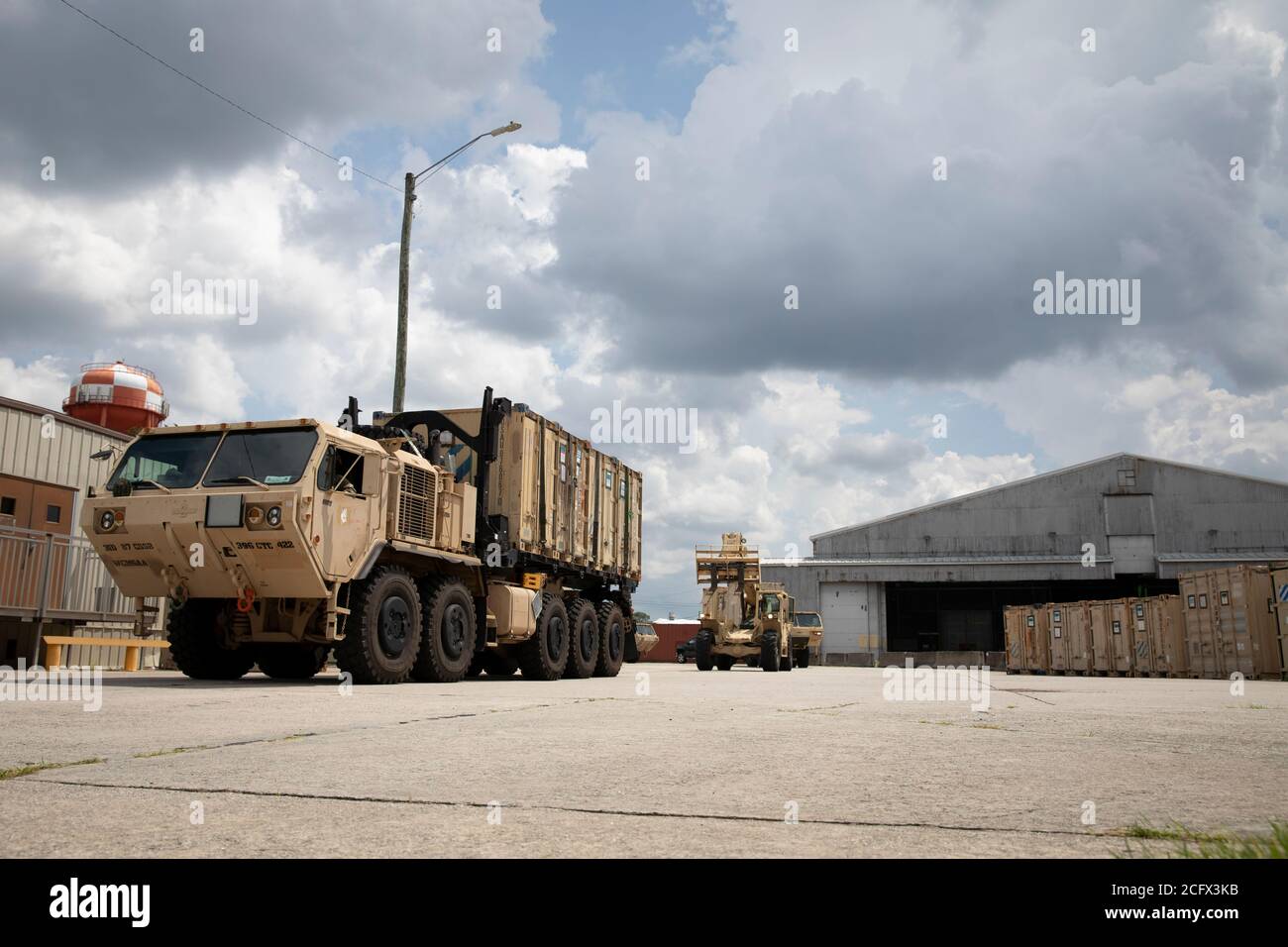 Soldiers assigned to the 3rd Infantry Division deliver containers to ...