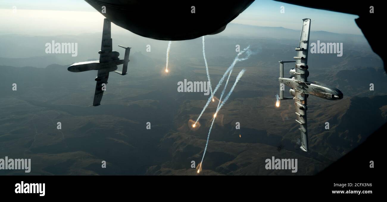 Two U.S. Air Force A-10 Thunderbolt II's fly over the U.S. Central Command area of ...