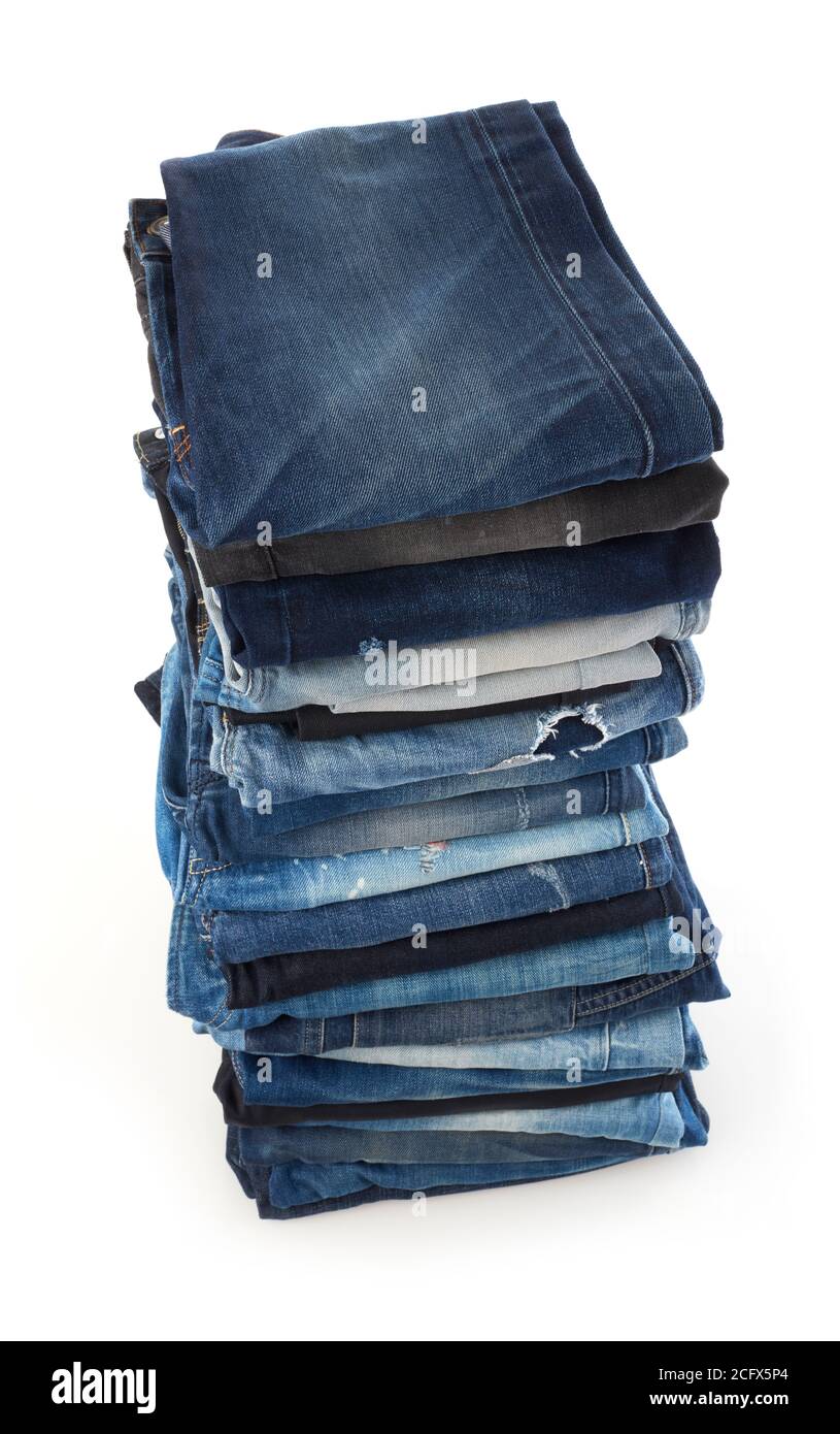 Pile of jeans isolated on white Stock Photo - Alamy
