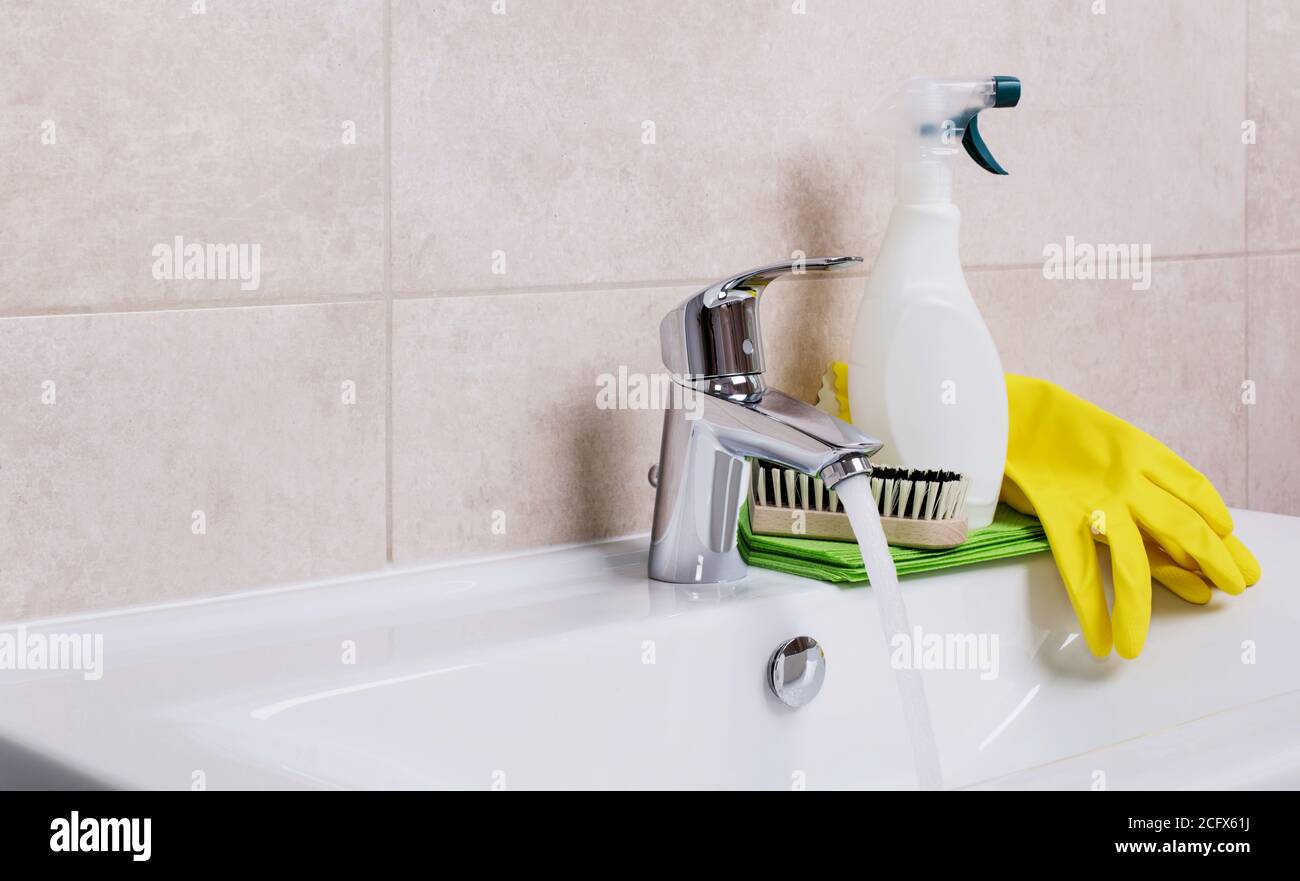 Cleaning equipment on bathroom sink Stock Photo - Alamy