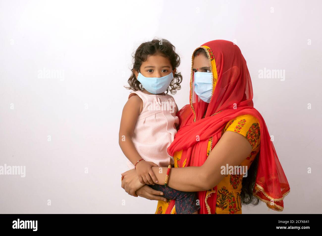 mother and daughter wearing mask Stock Photo - Alamy