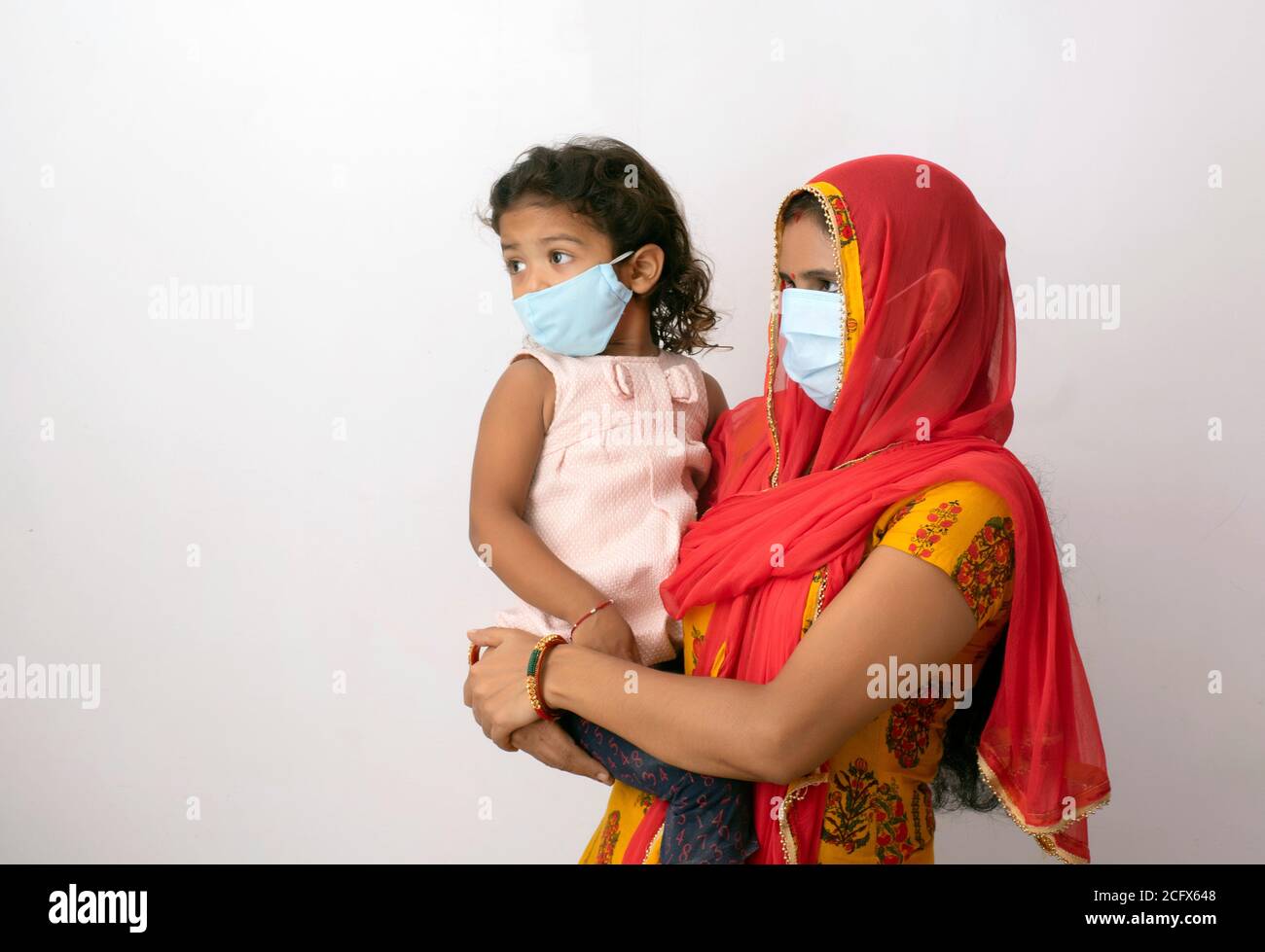 Indian family standing wearing traditional hi-res stock photography and ...