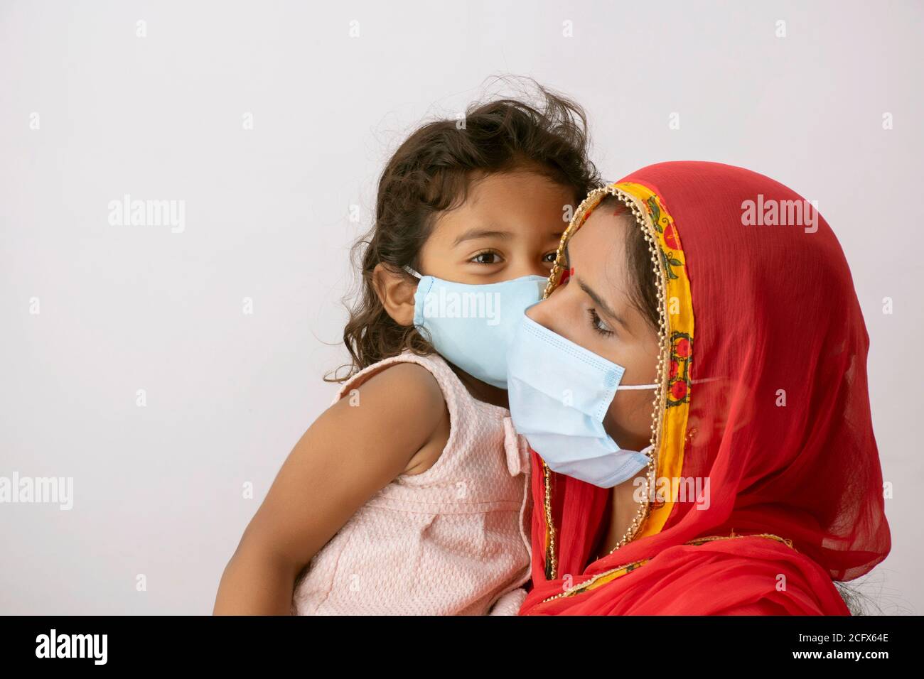 mother and daughter wearing mask Stock Photo - Alamy