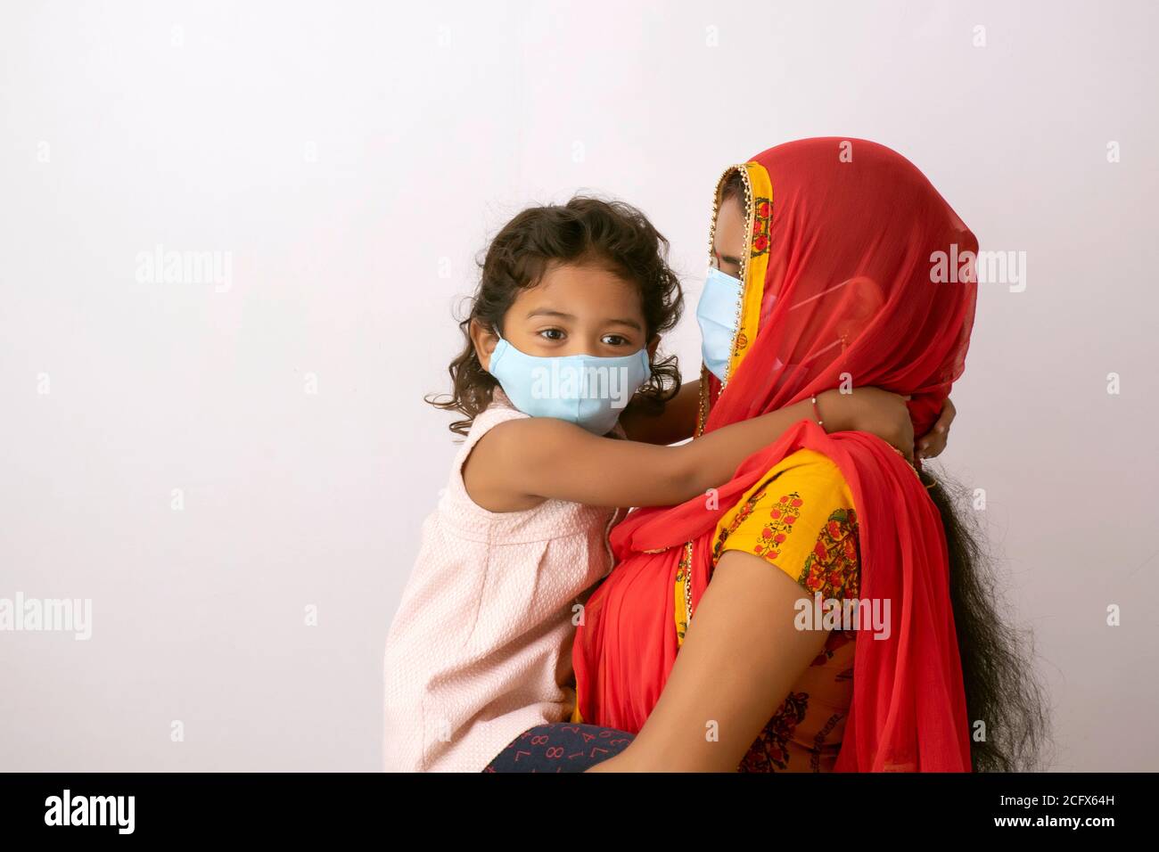 mother and daughter wearing mask Stock Photo - Alamy