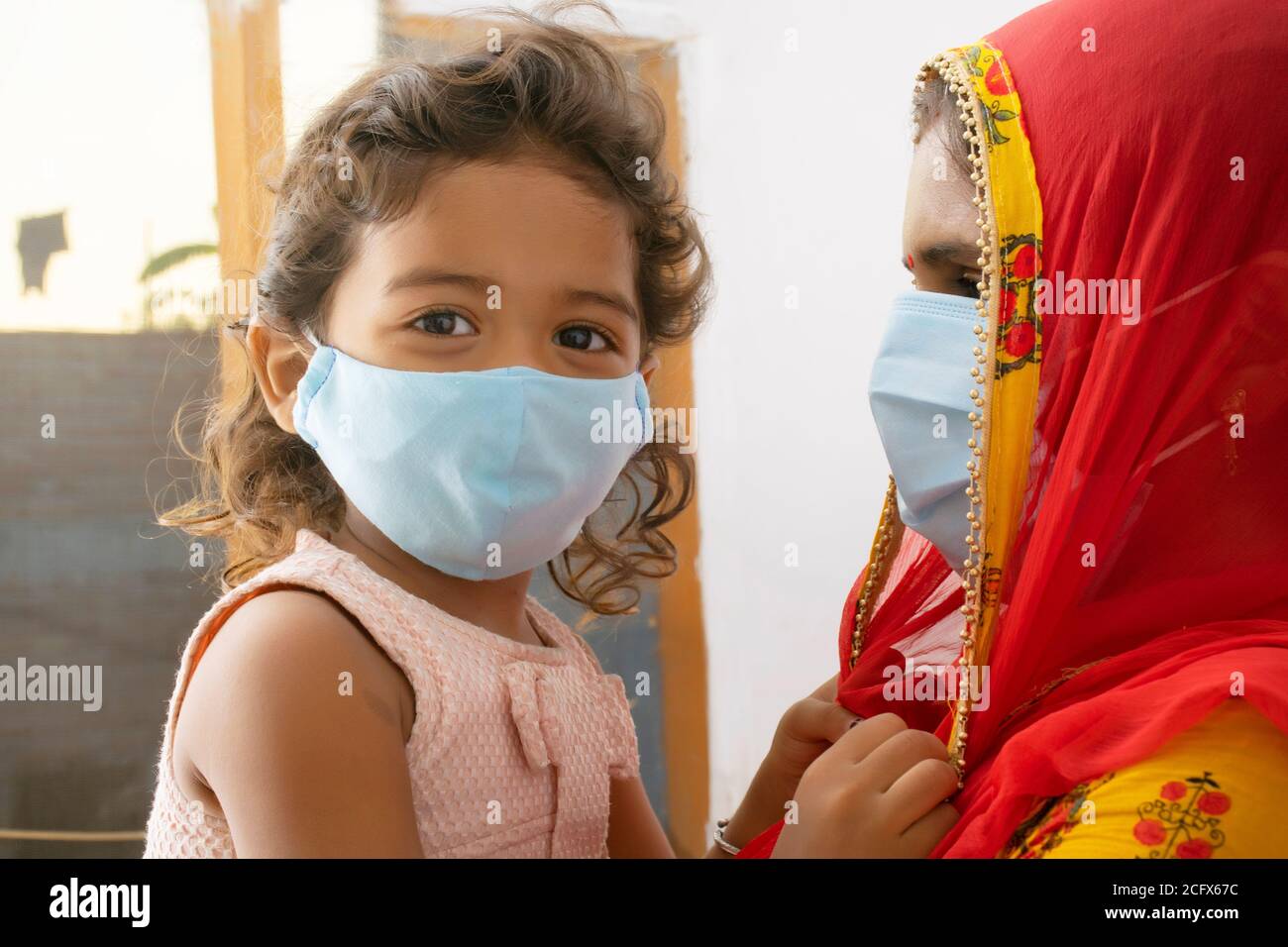 mother and daughter wearing mask Stock Photo - Alamy