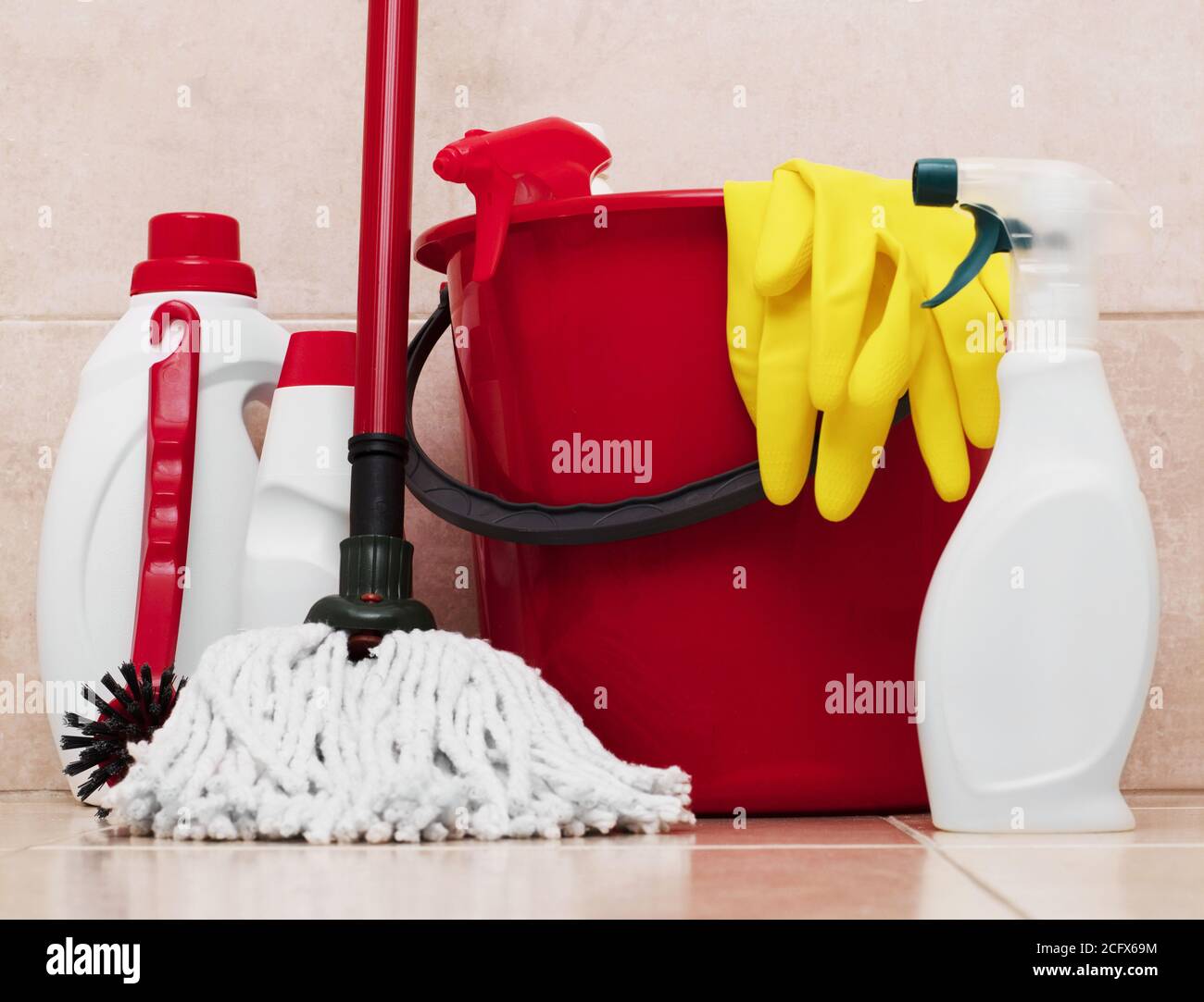 Cleaning supplies on floor tiles Stock Photo - Alamy