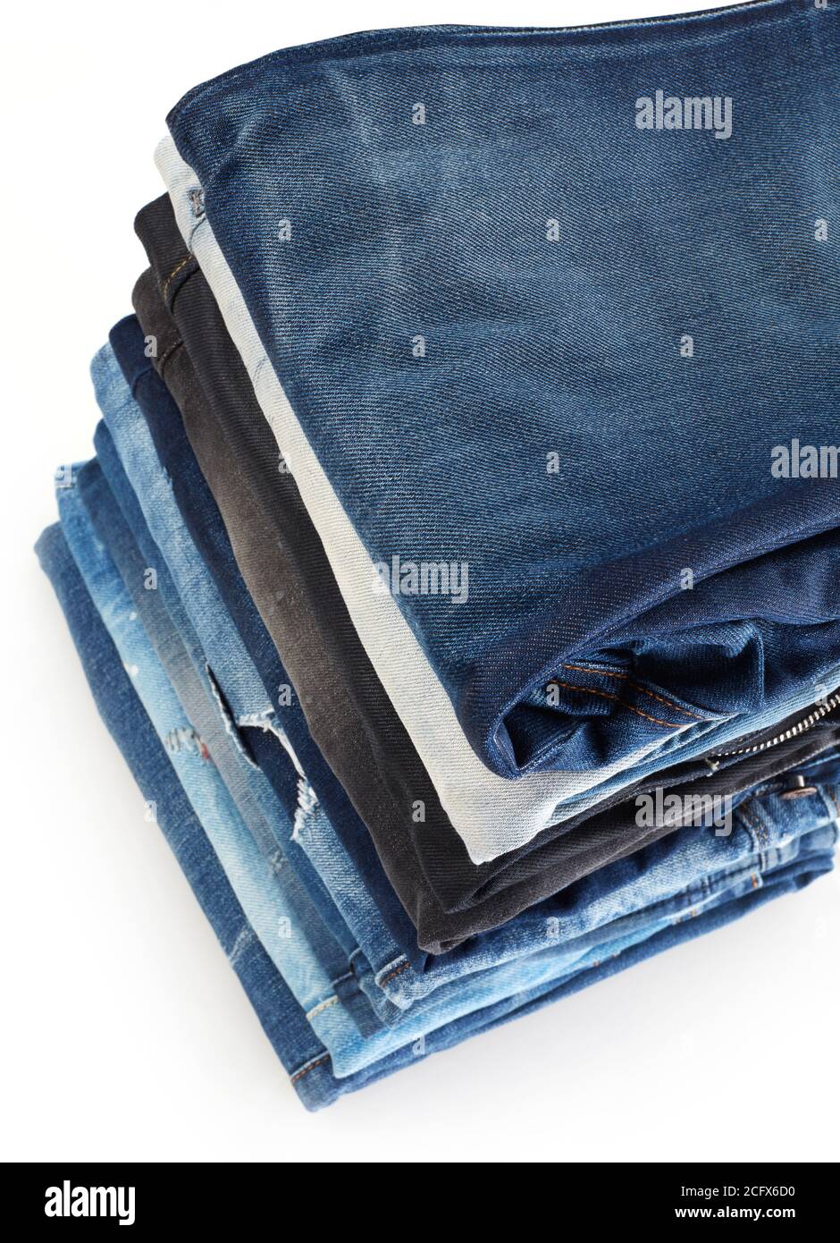 Pile of jeans isolated on white Stock Photo - Alamy