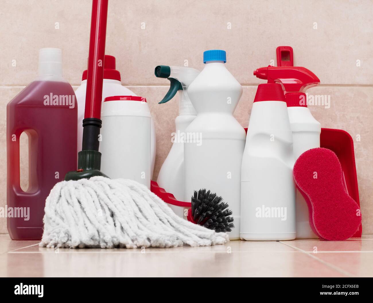 Cleaning supplies on floor tiles Stock Photo - Alamy