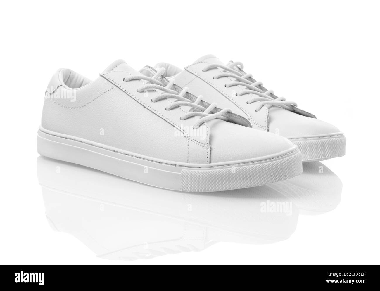 White sneakers isolated on white Stock Photo - Alamy