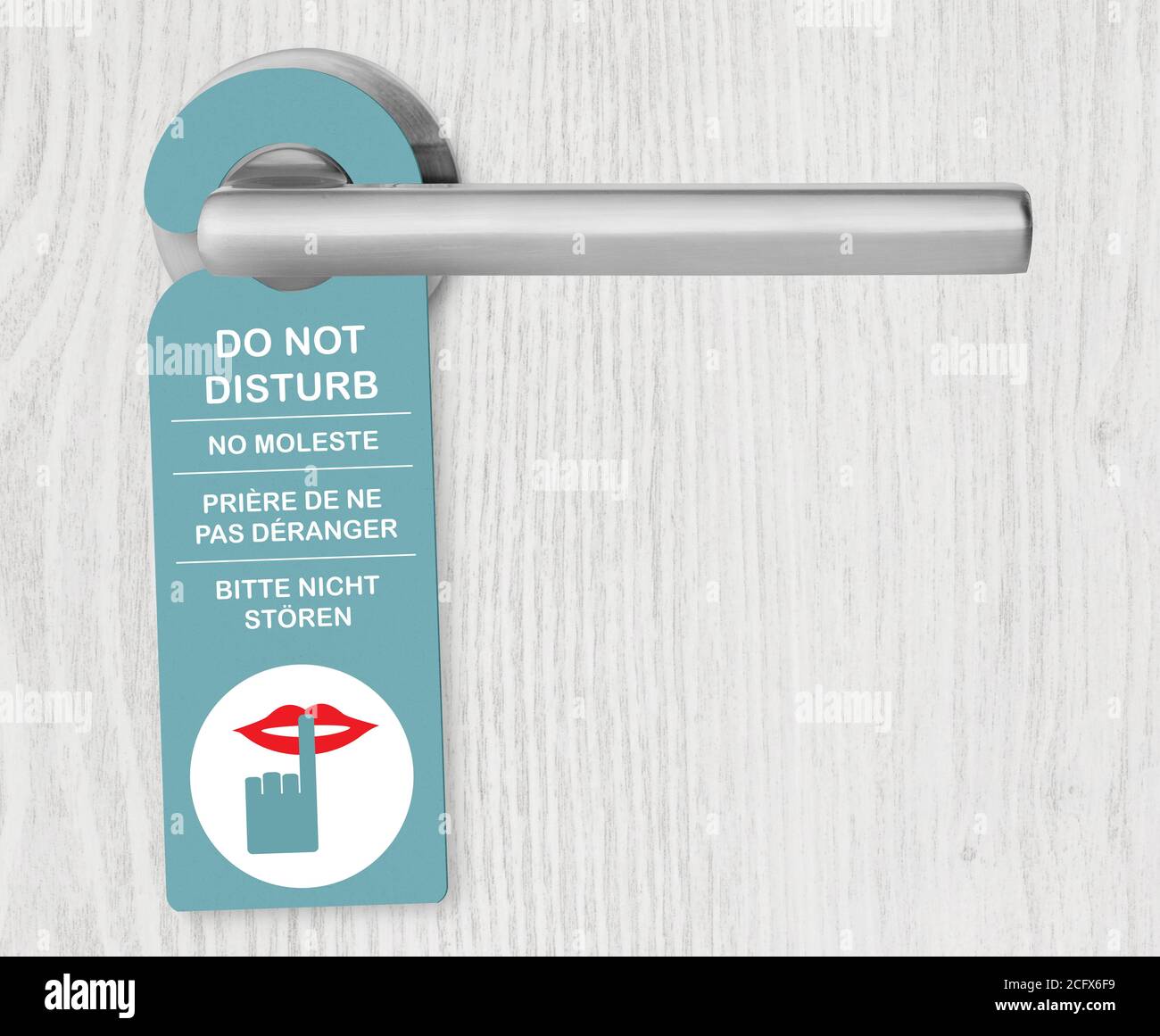 Do not disturb sign on door handle Stock Photo - Alamy