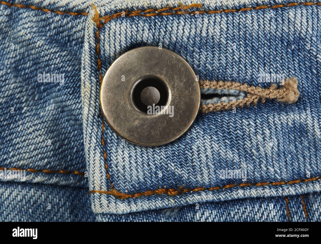 Jeans texture with button Stock Photo - Alamy
