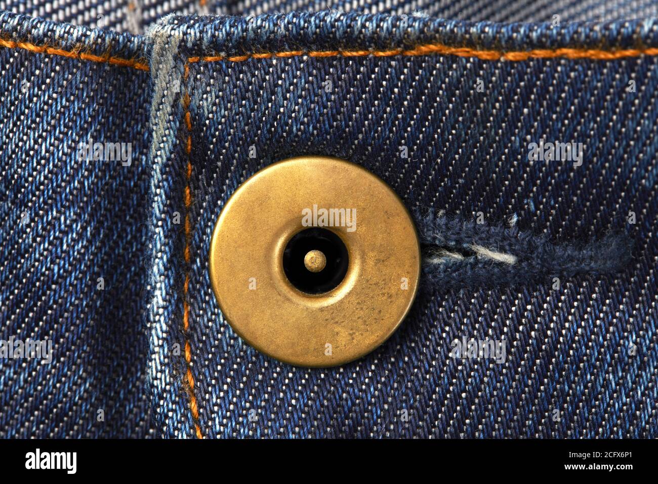 Jeans texture with button Stock Photo - Alamy