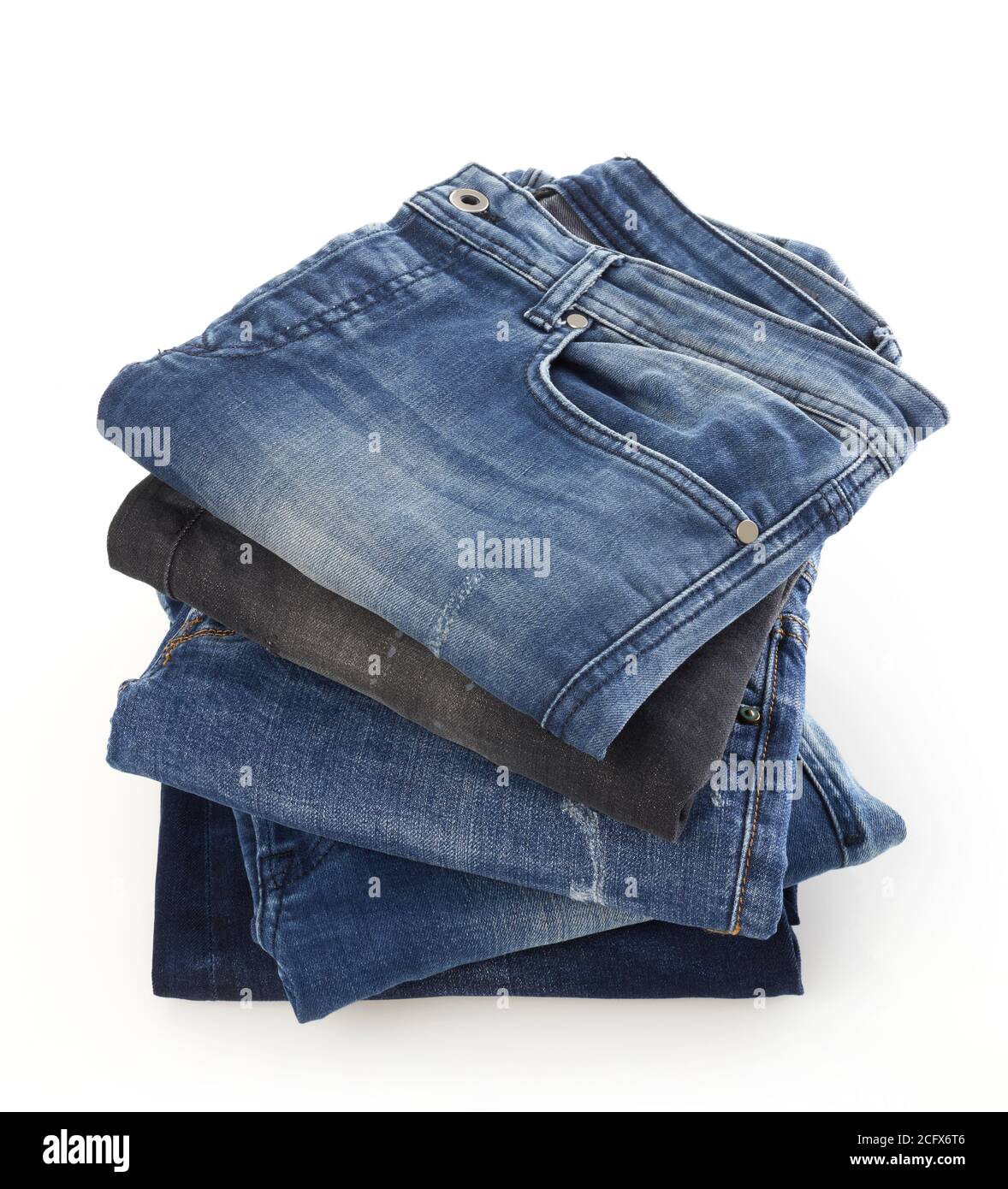 Stack of jeans isolated on white Stock Photo - Alamy