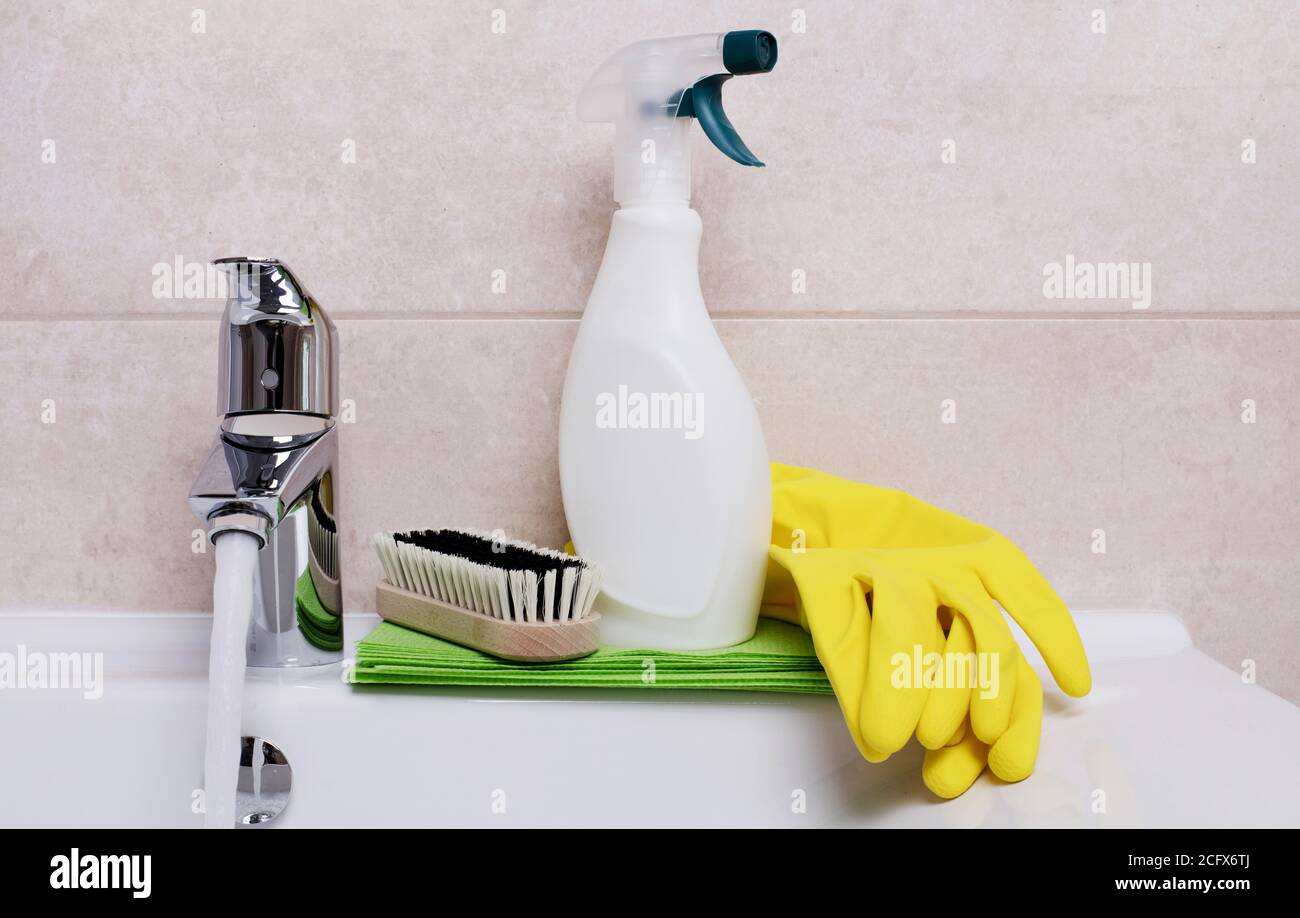 Cleaning products on sink Stock Photo - Alamy