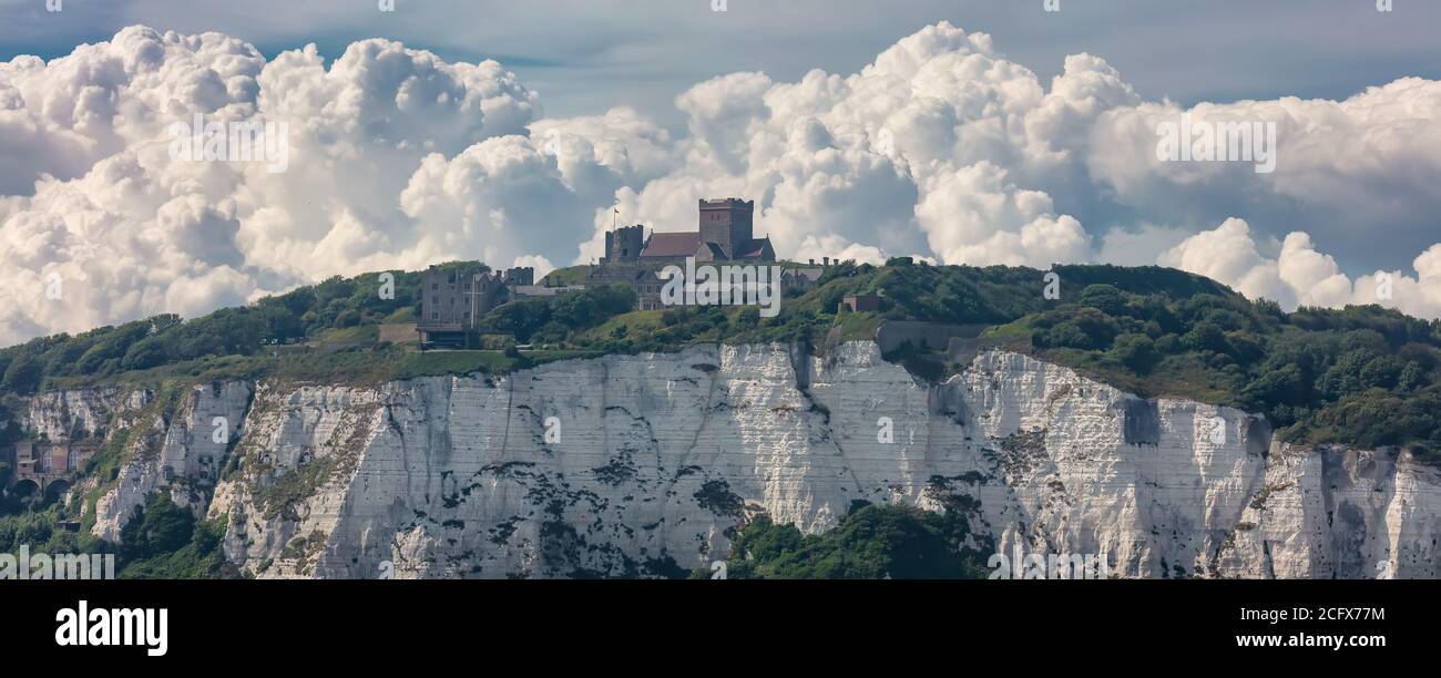 Panoramic shot of the White Cliffs of Dover and a castle on top of the ...