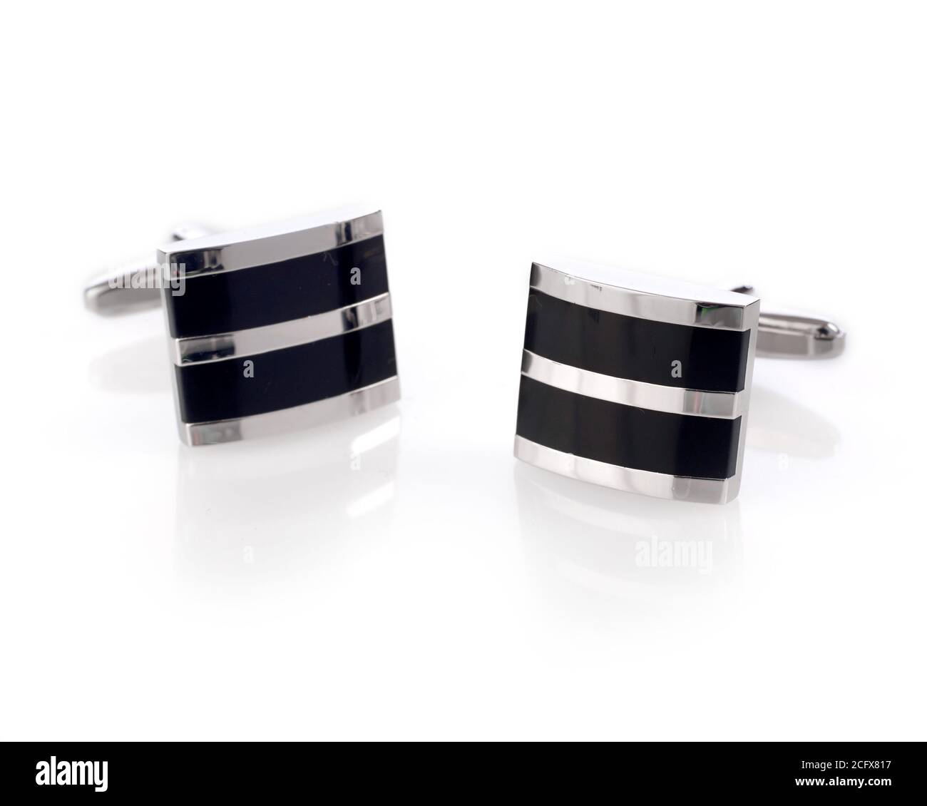 Cuff links isolated on white Stock Photo - Alamy