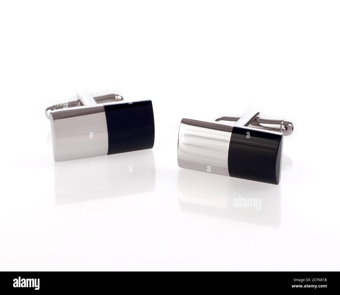 Cuff links isolated on white Stock Photo - Alamy