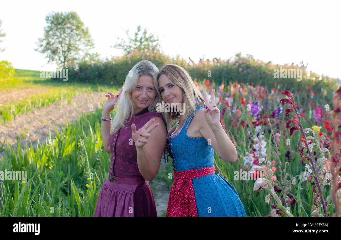 Two bavarian friends having fun in nature Stock Photo - Alamy