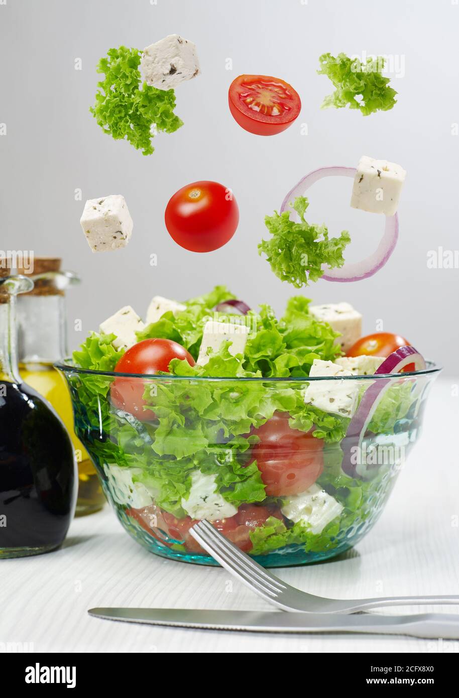 Falling vegetables in a salad bowl Stock Photo - Alamy