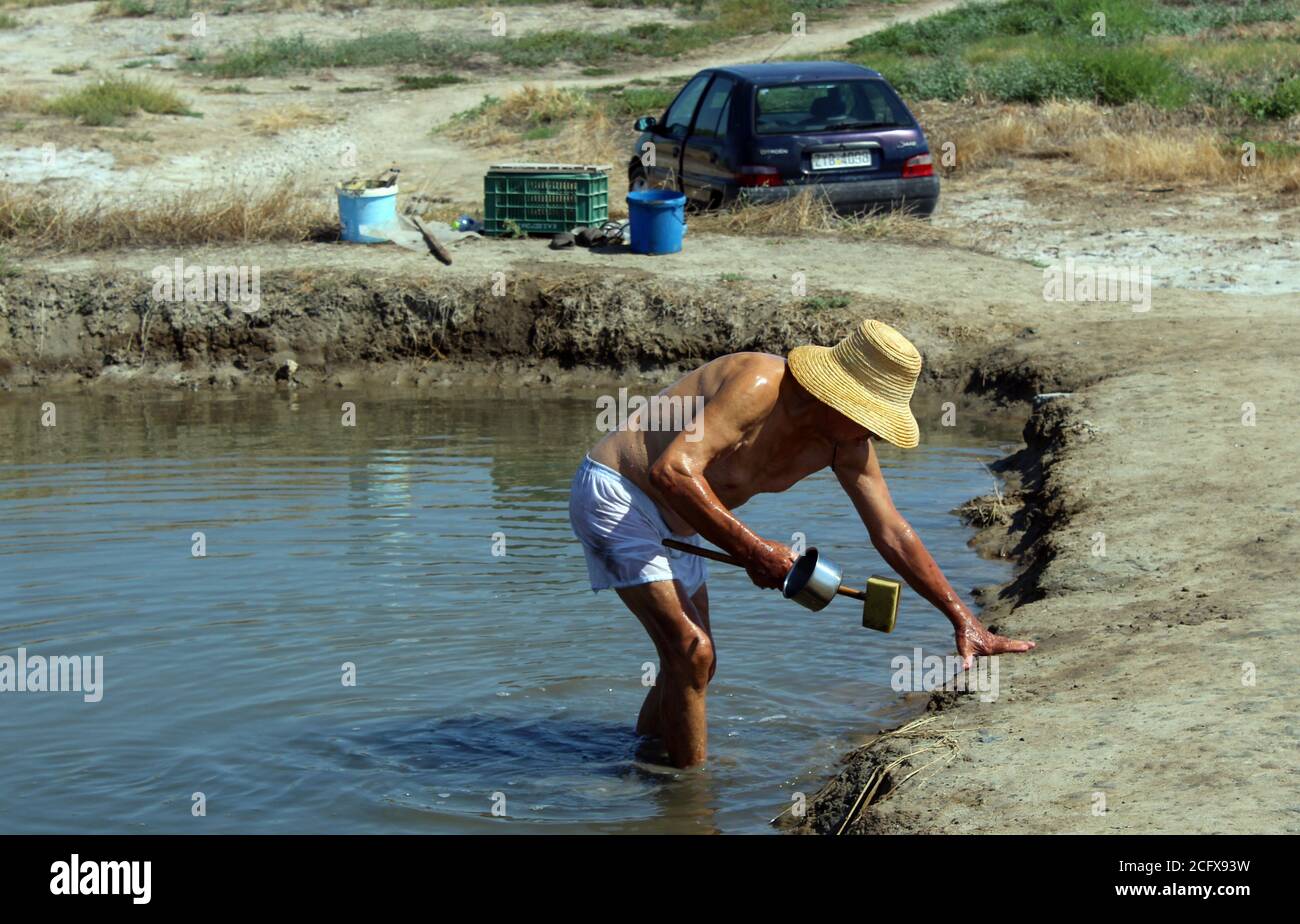 Visitors enjoy the mud-bathing process to help people who suffer from ...