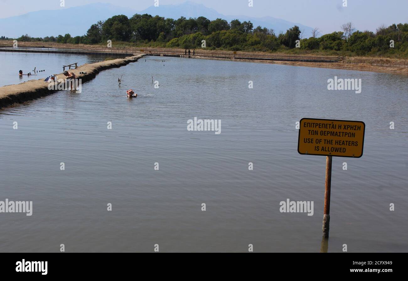 Visitors enjoy the mud-bathing process to help people who suffer from ...