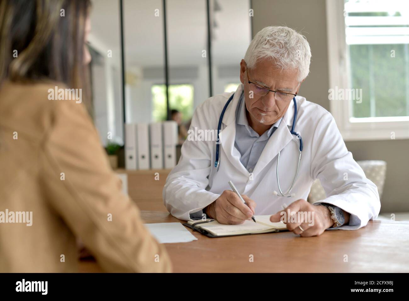 Doctor attending patient hi-res stock photography and images - Alamy