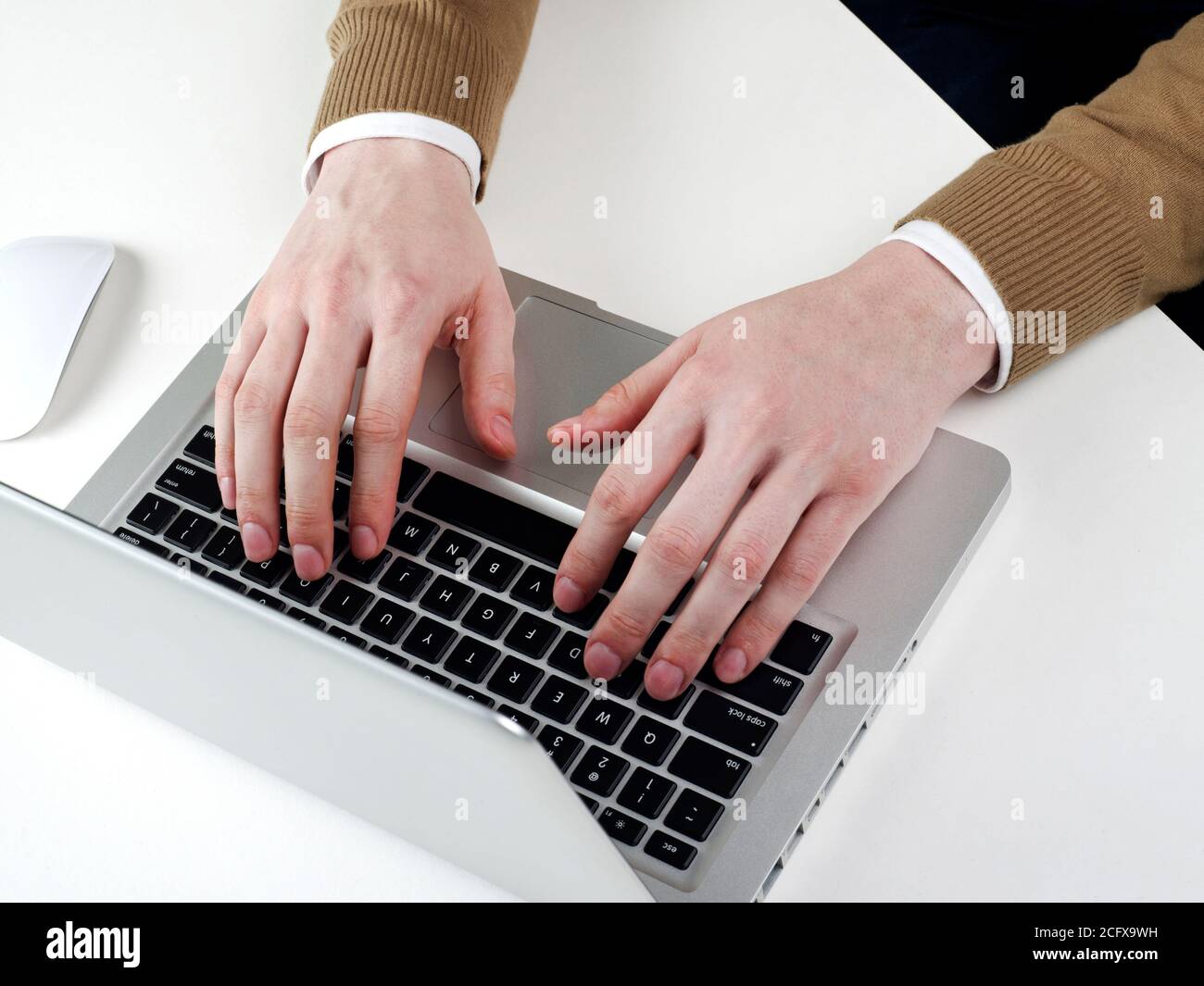 Hands on laptop Stock Photo - Alamy