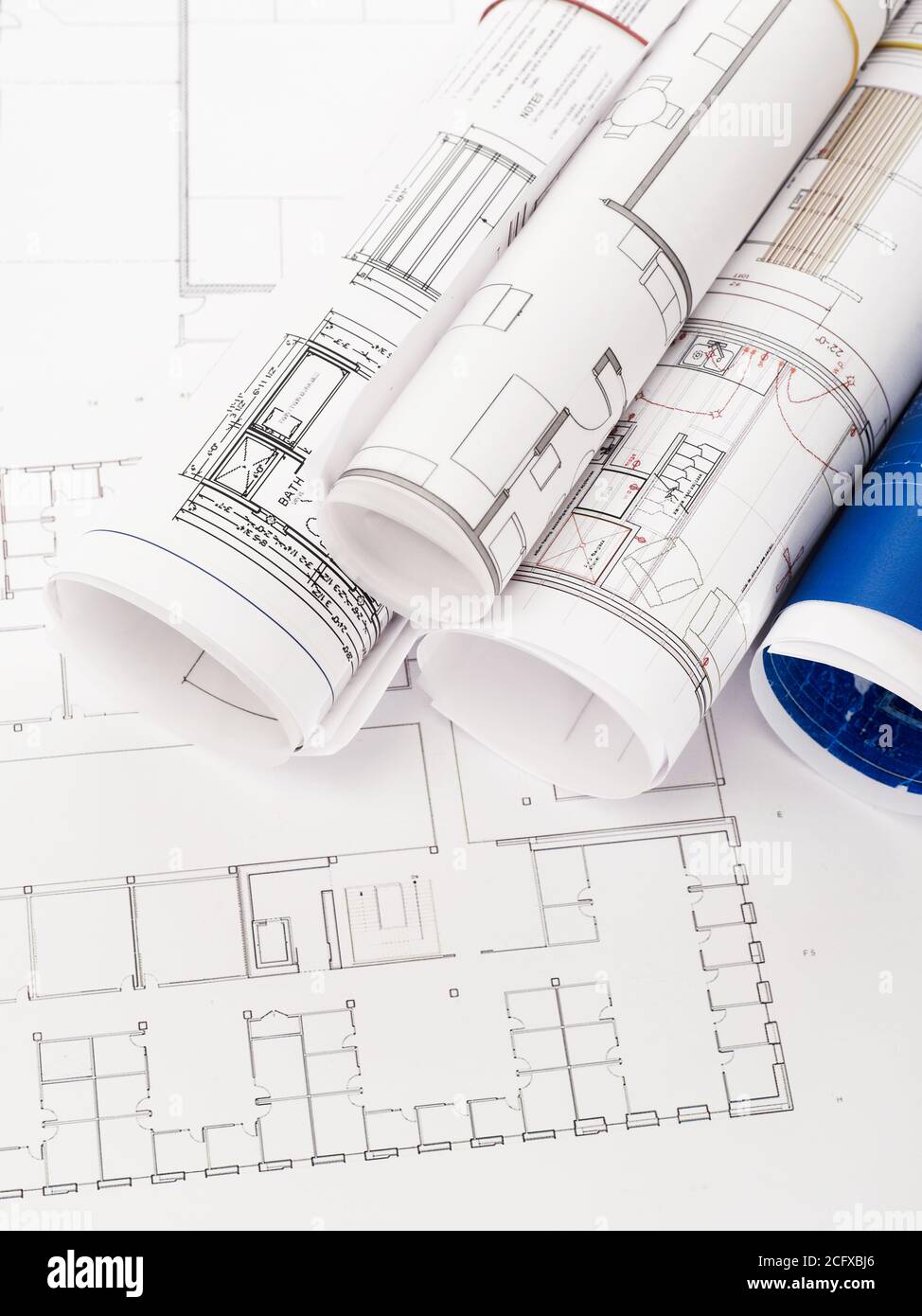 Rolled-up blueprints and house plans with copyspace Stock Photo - Alamy