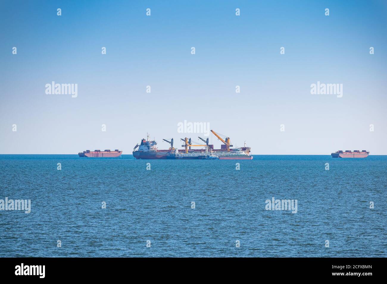 Bulk carrier is being loaded at sea Stock Photo - Alamy