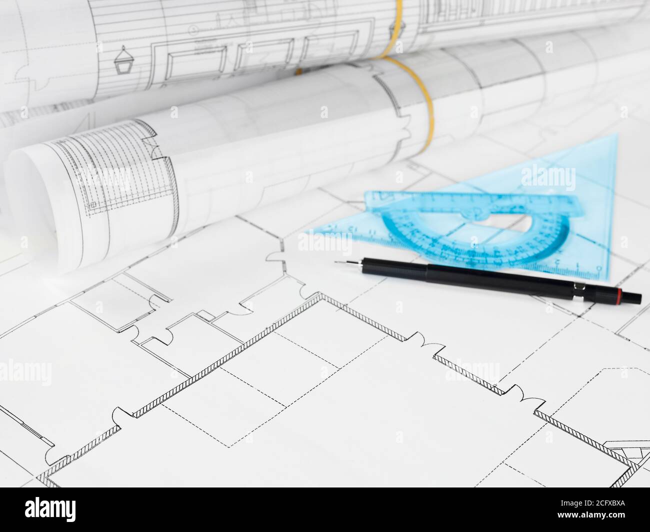 Blueprints and office supplies with copy space Stock Photo - Alamy