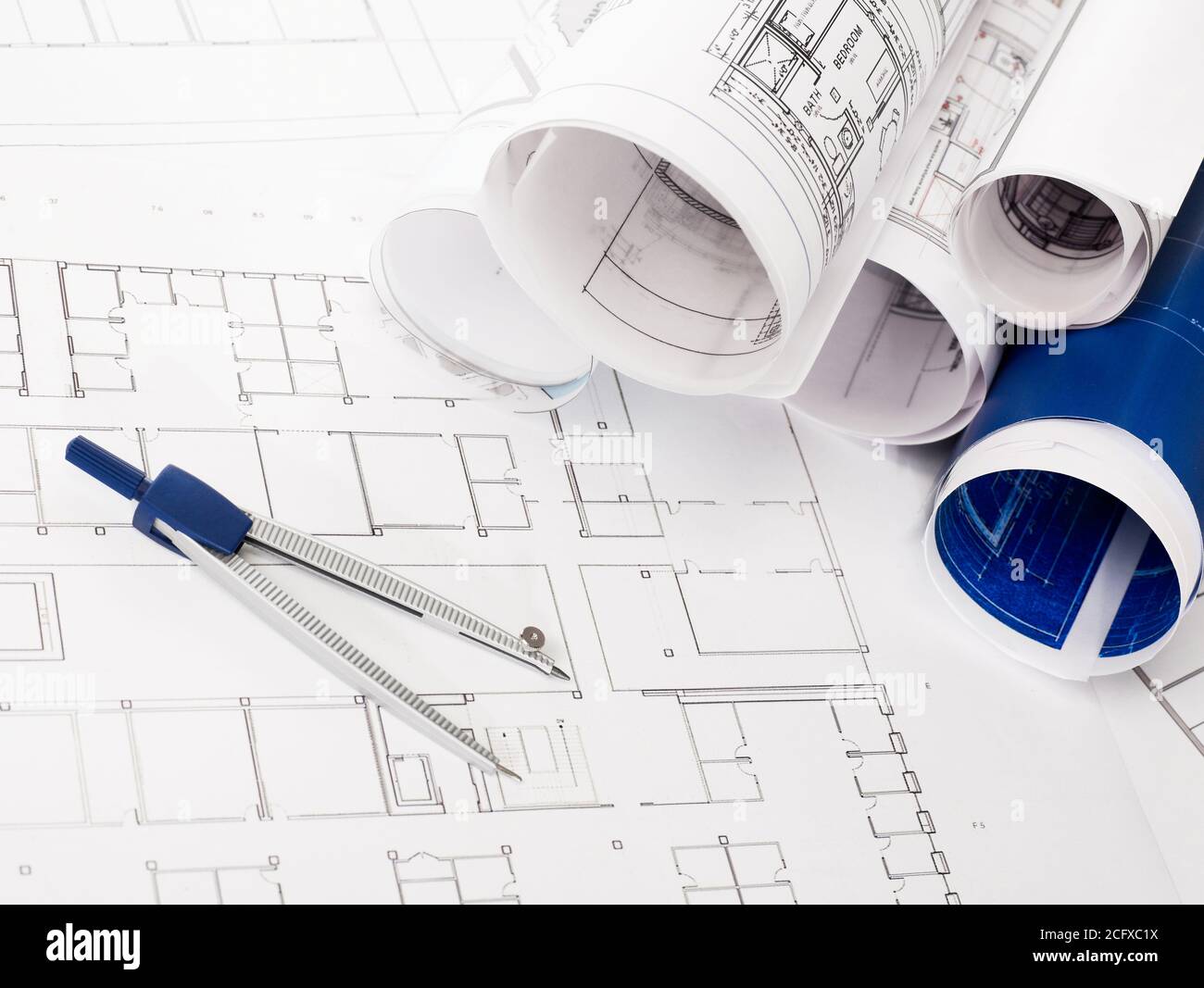 Blueprints and compass Stock Photo - Alamy